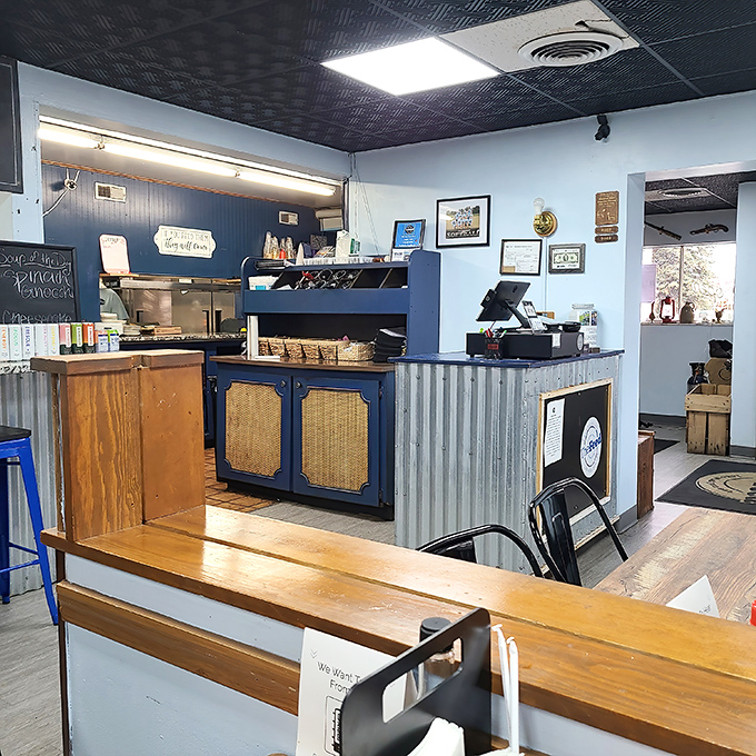 The heart of operations&mdash;where orders become meals and hungry visitors become satisfied regulars. Blue and wood create the perfect backdrop.