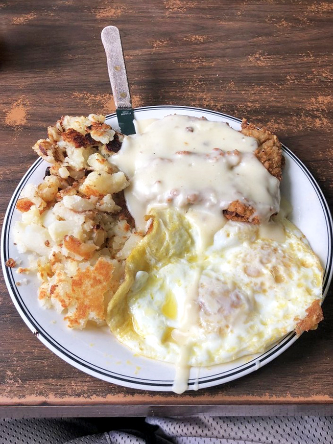 Country fried steak smothered in gravy with eggs sunny-side up&mdash;proof that sometimes the most photogenic food isn't on fancy plates, but in classic diners.