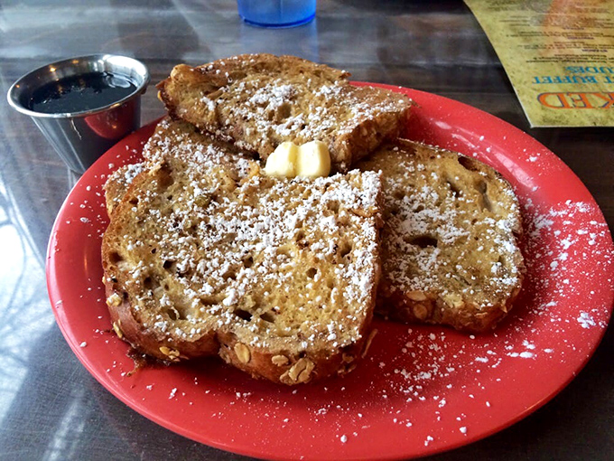 French toast that looks like it was dusted by a powdered sugar fairy and is waiting to make all your breakfast dreams come true.