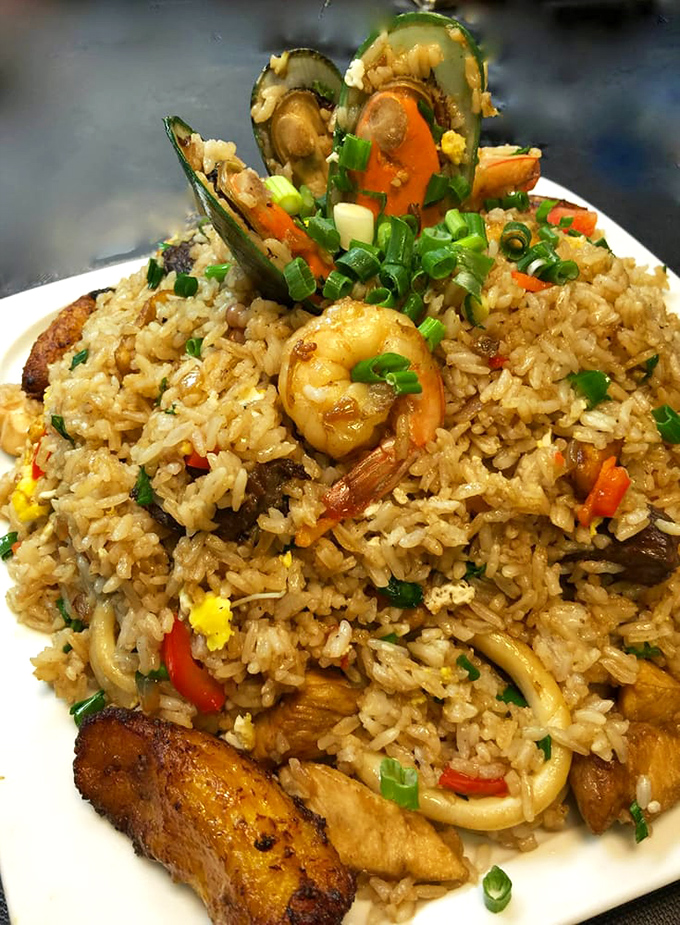 This isn't just fried rice&mdash;it's a party where seafood, meat, and vegetables all showed up wearing their best flavors. The mussel garnish is showing off.