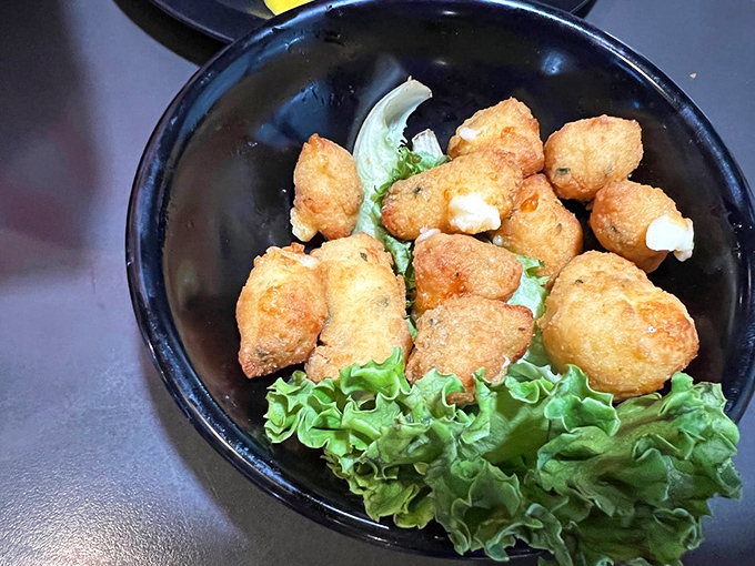 Golden-fried cheese curds nestled on crisp lettuce&mdash;little nuggets of Midwestern joy that squeak between your teeth and warm your soul with each bite.