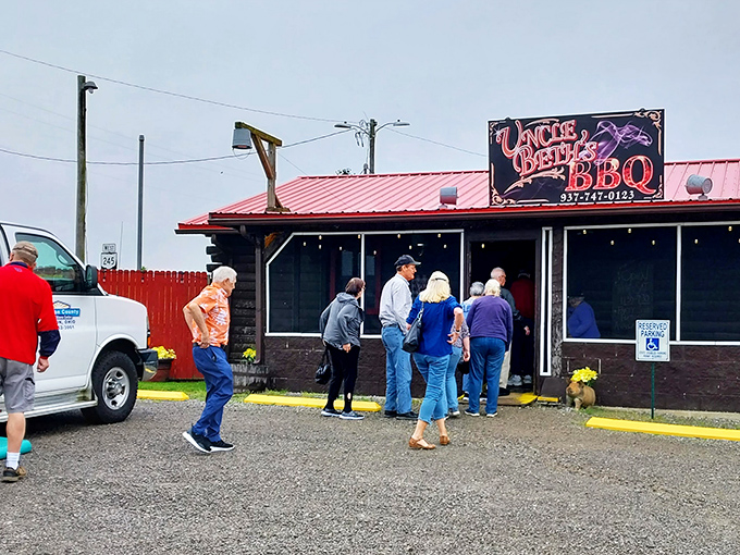 A line forming outside proves the universal truth: great BBQ is worth waiting for. That red roof is like a beacon for hungry travelers.
