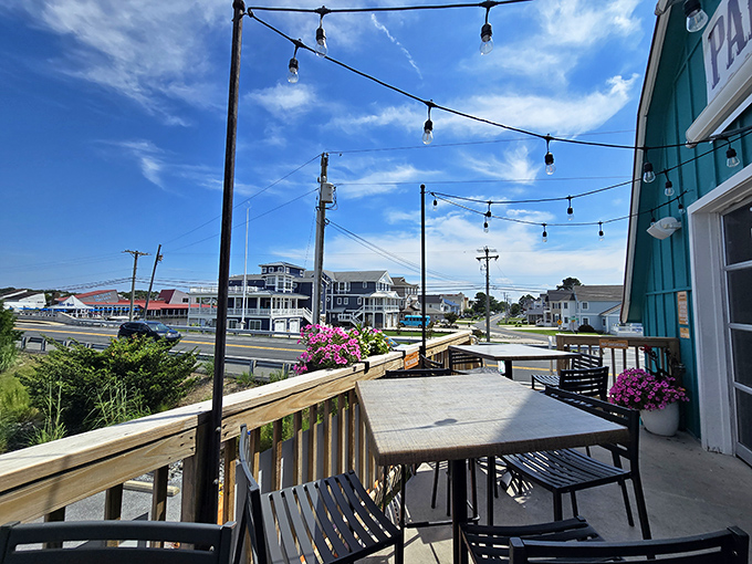 The deck offers more than just extra seating—it's front-row tickets to coastal Delaware's perfect blue-sky theater.