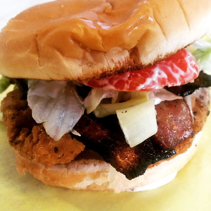 This isn't just a chicken sandwich&mdash;it's a skyscraper of flavor with bacon buttresses and vegetable viewpoints. Architectural deliciousness.