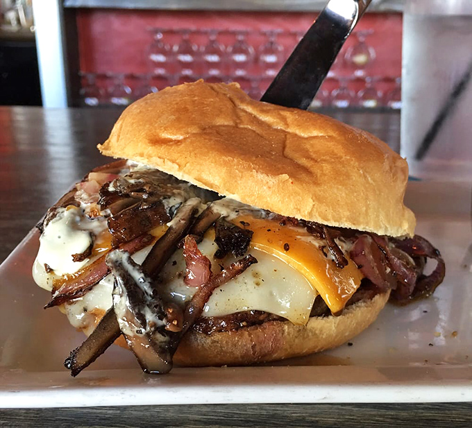 Behold the "Demi-God" burger in all its glory—the runny egg and mushrooms creating heaven between buns that mere mortals can only dream about.