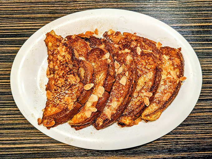 French toast that's dressed to impress. Those crispy edges and powdered sugar dusting deserve their own Instagram account.