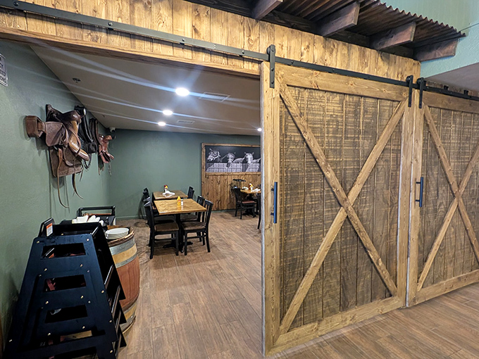 Rustic barn doors slide open to reveal private dining spaces&mdash;where carnivorous conspiracies and dessert plots are hatched in wood-paneled comfort.