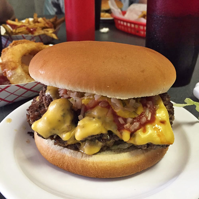 The double cheeseburger that makes vegetarians question their life choices. Those melted layers of American cheese are patriotism on a plate.