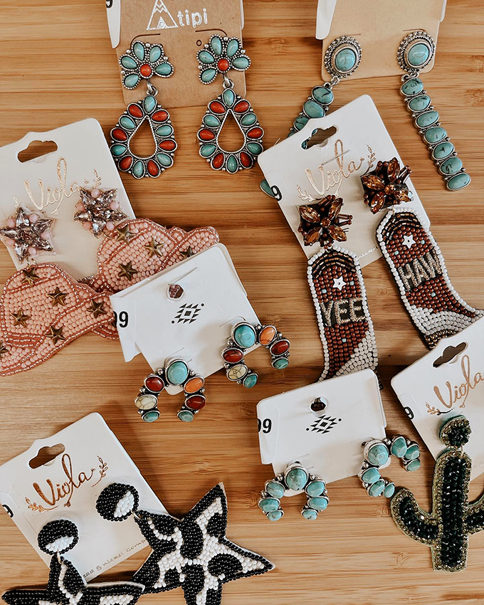 Statement earrings showcase how the right accessories can transform your entire look in seconds flat.