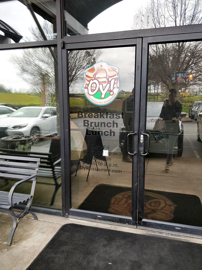 The entrance promises three essential meals, with hours clearly displayed. This doorway has witnessed countless hungry arrivals and satisfied departures.