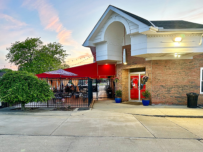 As evening falls, The Lobster Pot's patio beckons with the promise of al fresco dining. Those string lights aren't just illumination&mdash;they're atmosphere.