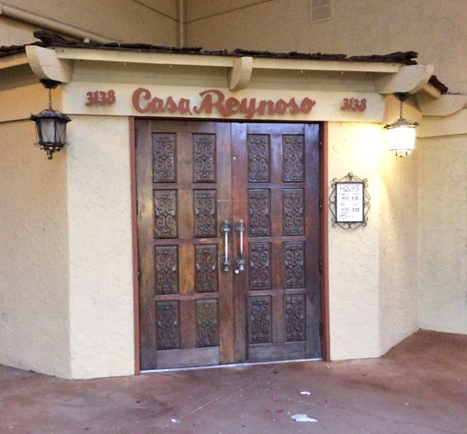 These ornate wooden doors mark the entrance to flavor paradise, where every meal becomes a memorable culinary adventure story.