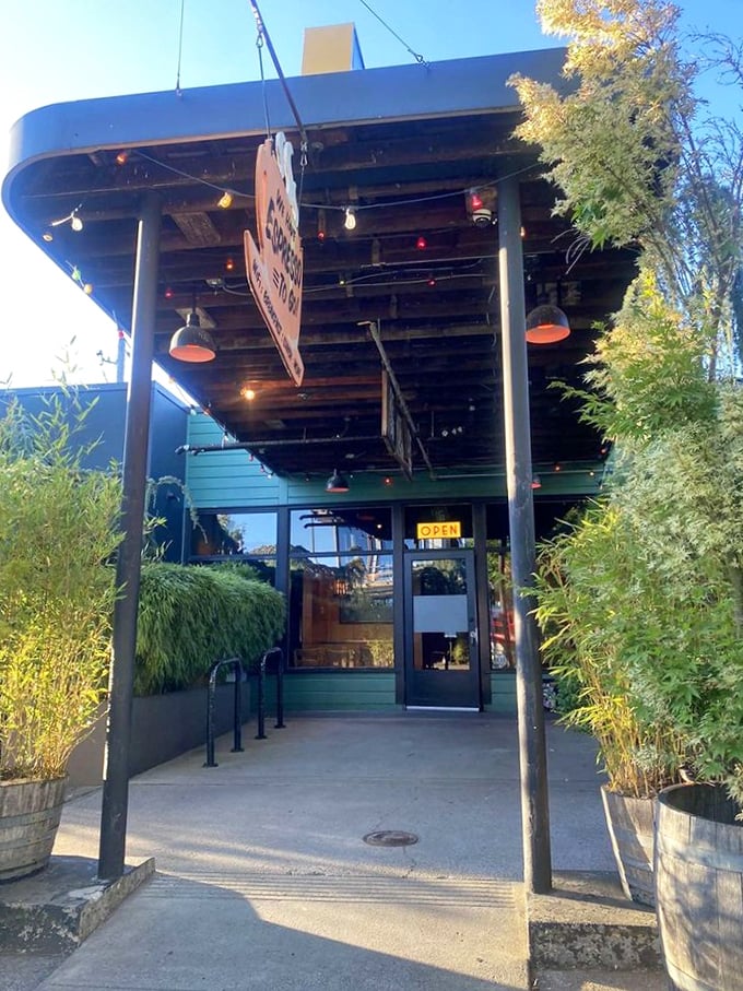 The entrance says "former gas station" but the bamboo and string lights whisper "come for dinner, stay for three hours." Portland's adaptive reuse at its most delicious.
