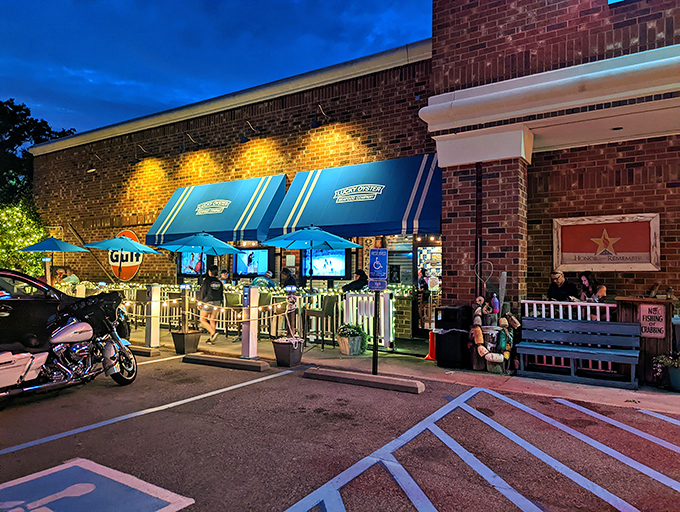 As night falls, the blue awnings glow like beacons, guiding hungry sailors to port at one of Virginia Beach's beloved institutions.