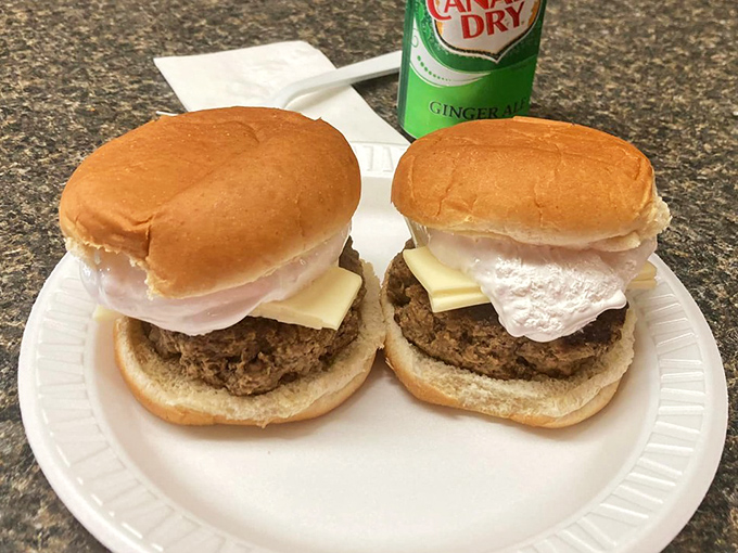 These burgers with their pillowy white topping aren't just food &ndash; they're an engineering marvel of texture and flavor that demands respect.