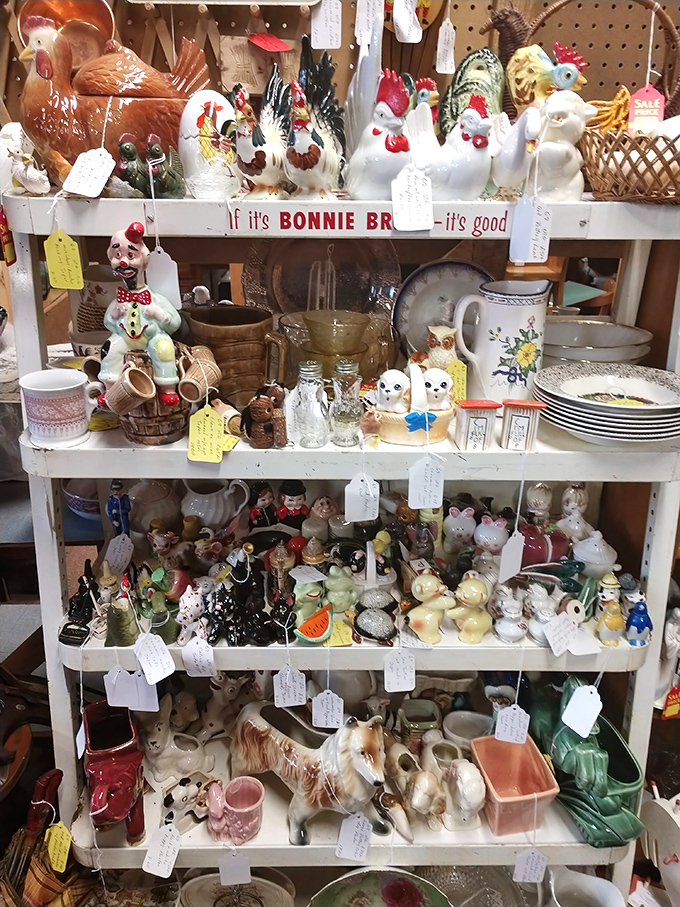 Grandma's china cabinet comes to life with whimsical figurines and kitchenware that transforms ordinary shelves into a nostalgic trip through mid-century Americana.