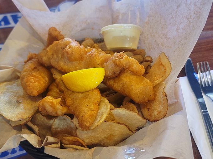 Golden-fried fish nestled among house-made chips – comfort food that makes you wonder why you ever bother with fancy restaurants in the first place.