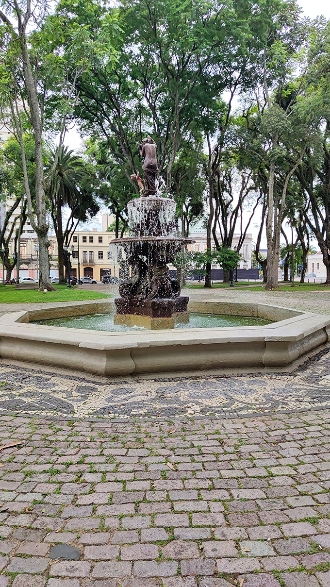 A classical fountain in what appears to be a town square. Dublin offers more traditional beauty alongside its famous concrete corn curiosity.