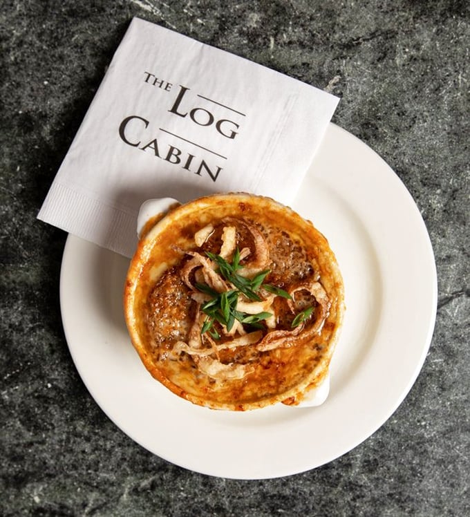 French onion soup with a golden crown of bubbling cheese &ndash; comfort food that's dressed for a black-tie affair at your table.