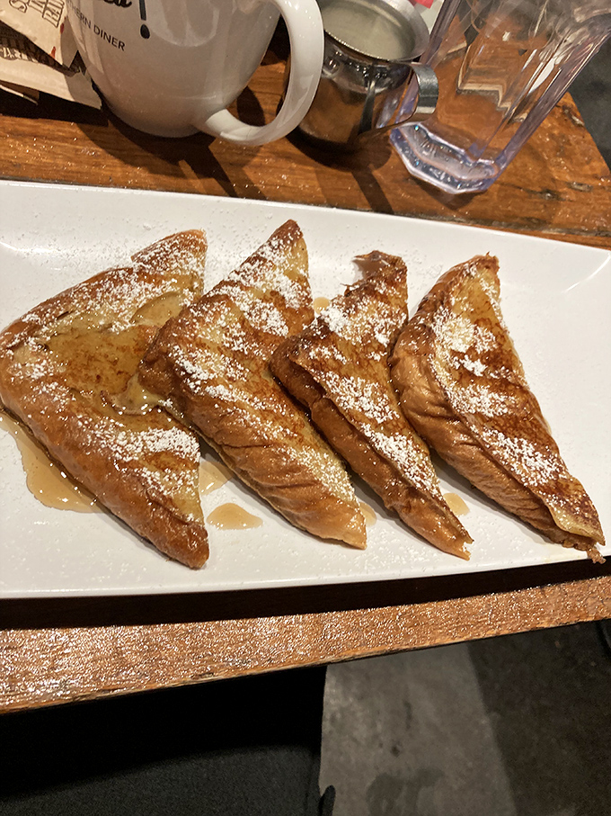 French toast triangles dusted with powdered sugar and drizzled with syrup&mdash;breakfast that doubles as dessert and triples as pure morning bliss.