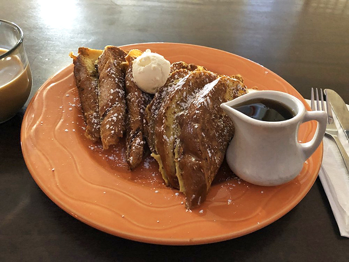 French toast that's simultaneously crisp-edged and custardy-centered &ndash; the breakfast equivalent of hitting the lottery on a Tuesday morning.