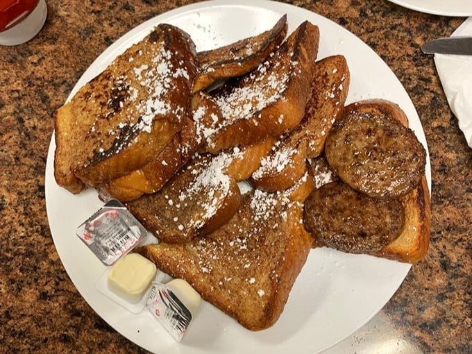 French toast that deserves its own thank-you note&mdash;thick-cut bread transformed into a powdered-sugar paradise that makes you wonder why people eat cereal.