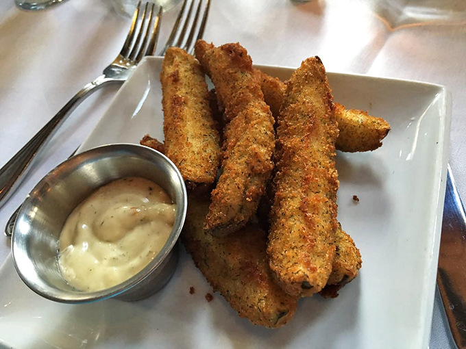 Fried dill pickles&mdash;crispy, golden soldiers standing at attention beside their creamy dipping sauce commander. A southern comfort food that demands attention.