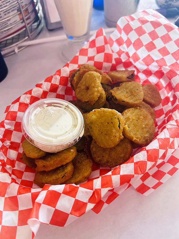 Fried pickles: The perfect union of crispy and tangy. These golden discs aren't just appetizers&mdash;they're conversation starters with dipping sauce.
