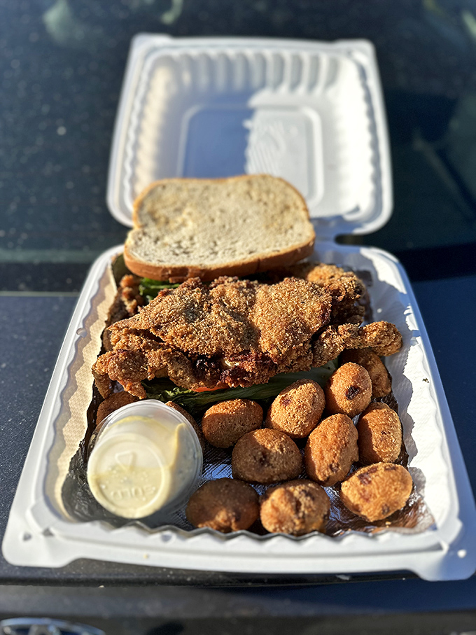 The to-go container that promises a seafood feast wherever you please. Those hush puppies are the unsung heroes of any proper Maryland meal.