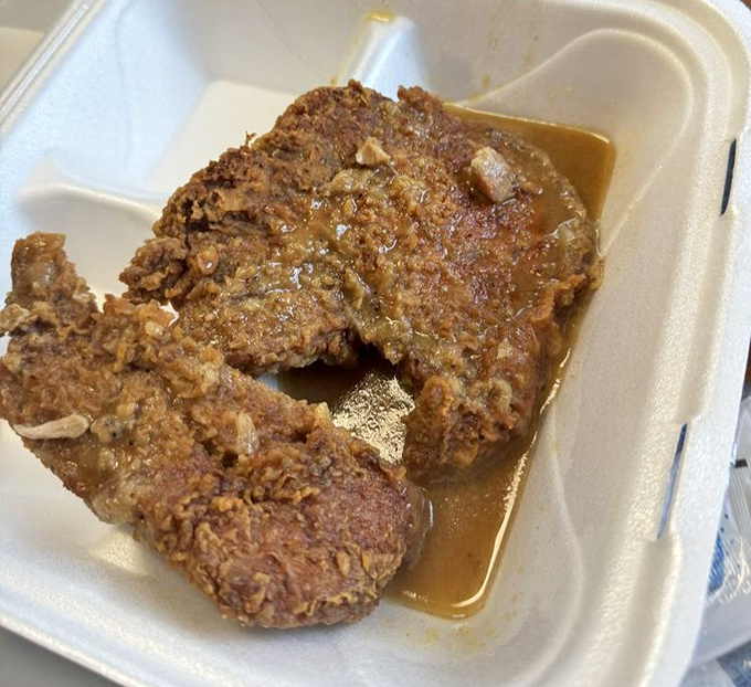 Pork chops bathing in gravy so good you'll want to write it love letters. The kind of dish that makes you close your eyes with each bite.