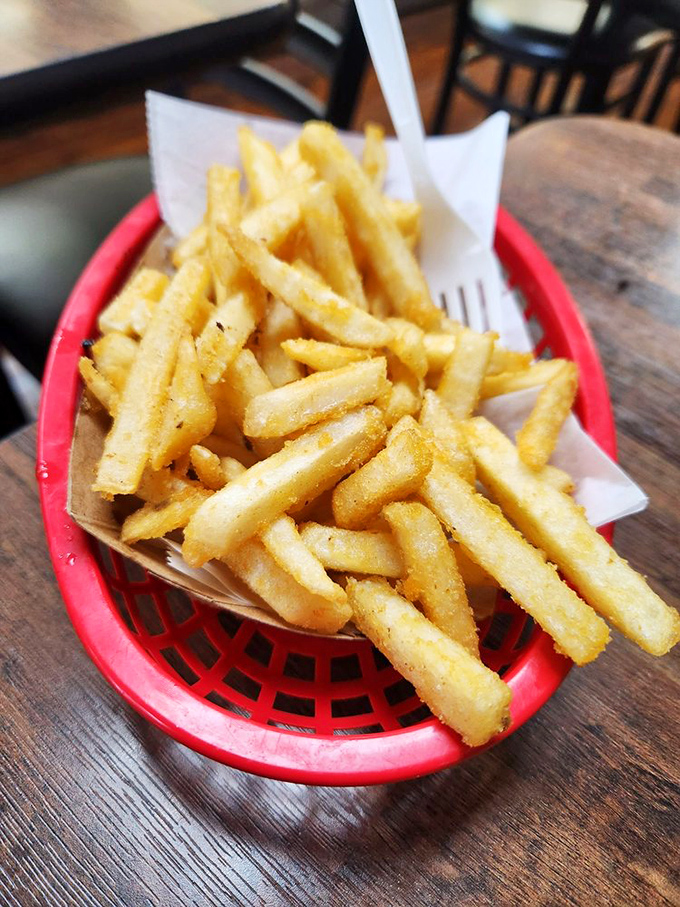 These aren't just french fries; they're golden happiness sticks, perfectly crisp and ready to accompany your sandwich adventure.