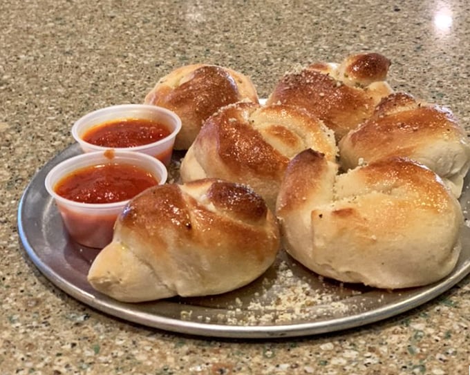 Garlic knots that look like they're huddling together, plotting how to make your breath memorable. Worth every garlicky moment of aftermath.