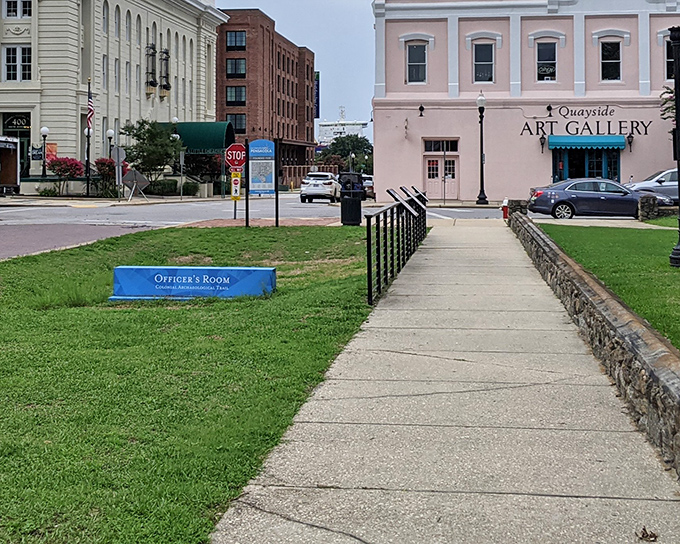 The Quayside Art Gallery stands as a cultural cornerstone in downtown Pensacola. That blue sign in front is practically begging for a selfie moment.