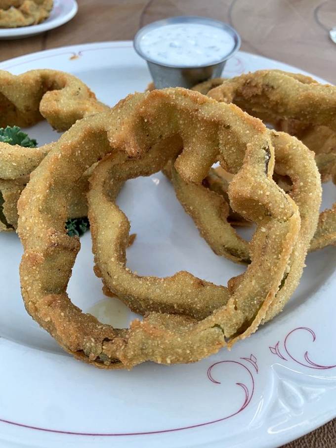 Onion rings that put fair food to shame &ndash; golden halos of crunchy, savory goodness that somehow taste even better with an old fashioned.
