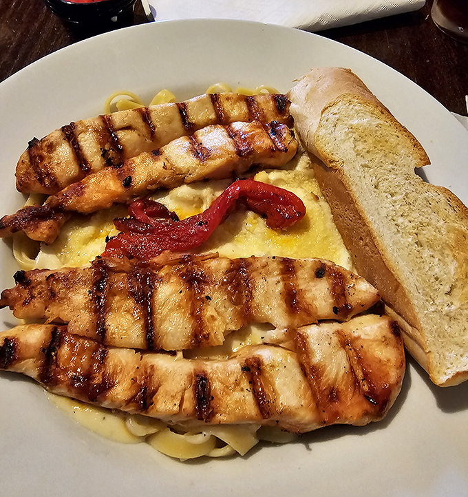 Grilled catfish proves this kitchen isn't just about frying. Those perfect grill marks are the culinary equivalent of a chef's signature.