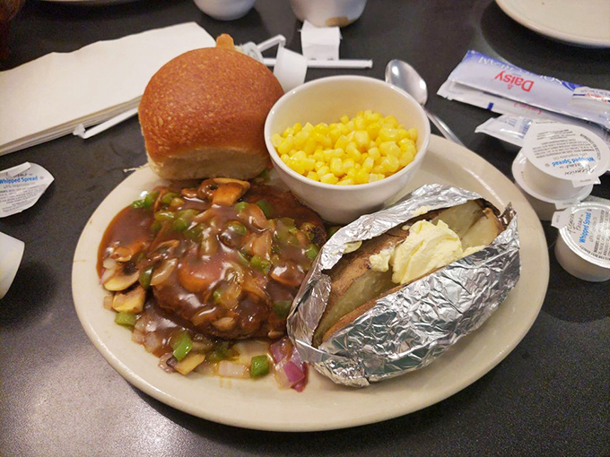 When your hamburger steak comes with mushroom gravy, a loaded baked potato, and corn&mdash;you know someone in that kitchen really cares about you.