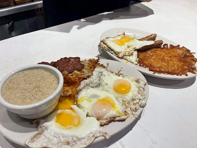 Sunny-side-up eggs with golden hash browns and creamy grits&mdash;the breakfast trinity that makes mornings worth facing.Sunny-side-up eggs with golden hash browns and creamy grits&mdash;the breakfast trinity that makes mornings worth facing.