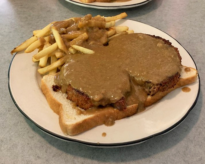 The hot meatloaf sandwich – where gravy isn't just an addition, it's a philosophy. Comfort food in its purest form.
