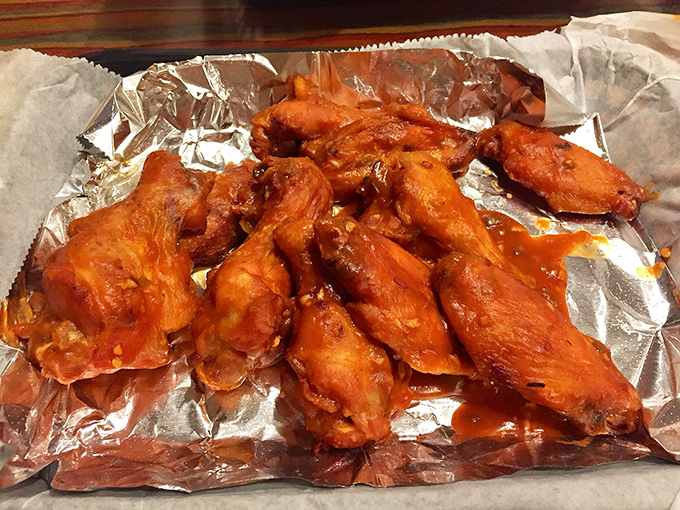 These wings aren't just coated in sauce &ndash; they're baptized in it. The kind of finger-licking goodness that makes napkins necessary but optional.