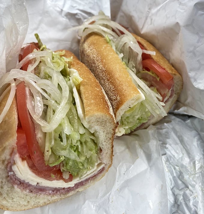 The Italian hoagie in its natural habitat &ndash; simple white paper that will soon bear the honored stains of oil, vinegar, and satisfaction.
