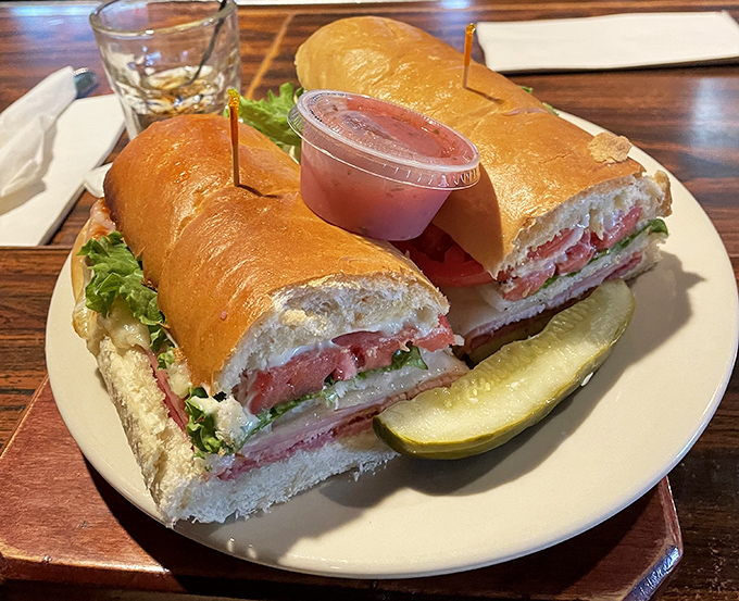 This Italian hoagie isn't just a sandwich; it's an architectural achievement &ndash; layers of meats and cheeses creating a flavor skyscraper that demands to be admired before eaten. 