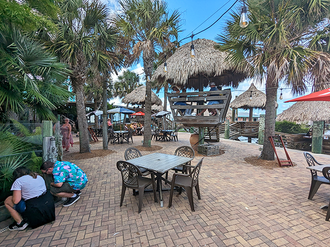 Palm trees and thatched huts create a tropical oasis where the only thing more refreshing than the breeze is what's in your glass.