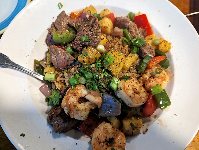 A colorful celebration on a plate! This jambalaya combines seafood, meat, and vegetables in a spice-forward fiesta that brings New Orleans flavor to Florida shores.