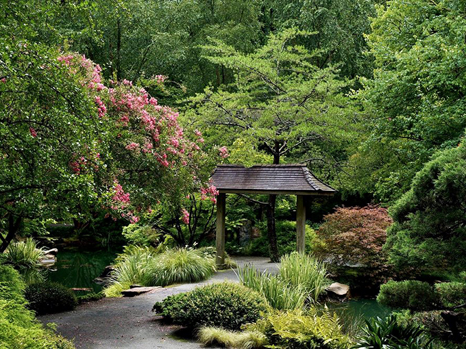 Japanese garden elements create tranquil harmony under the canopy of Georgia trees. East meets South in the most delightful way.