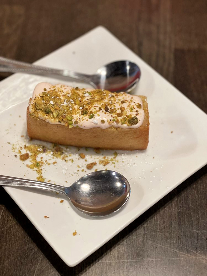 Lemon cake topped with strawberry cream and pistachios&mdash;the sweet finale that somehow leaves room for "just one more pierogi" next time.