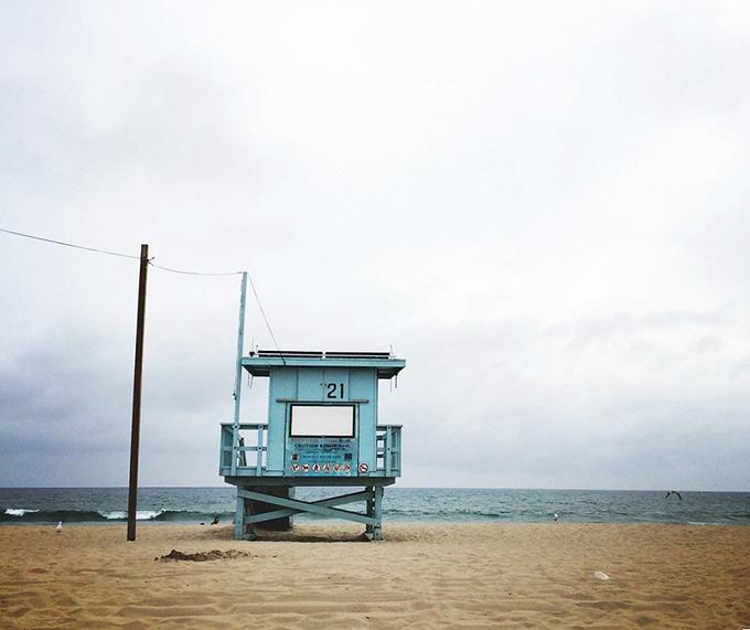 Iconic lifeguard stations stand as colorful sentinels of safety, ready for their close-up in your vacation photos.