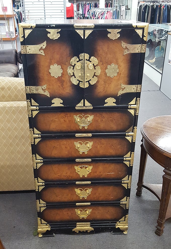 Asian-inspired elegance meets functional storage in this statement piece. This ornate chest transforms any room from ordinary to extraordinary with vintage flair.