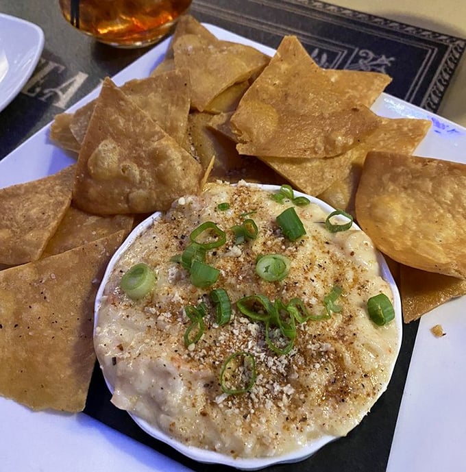 Creamy dip surrounded by crispy triangles of joy. This appetizer creates the perfect excuse to linger longer over drinks and conversation.