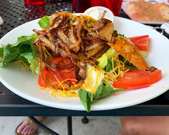This isn't just a chicken salad—it's a protein-packed flavor festival with crispy onions playing the role of confetti. Healthy-ish never looked so good.