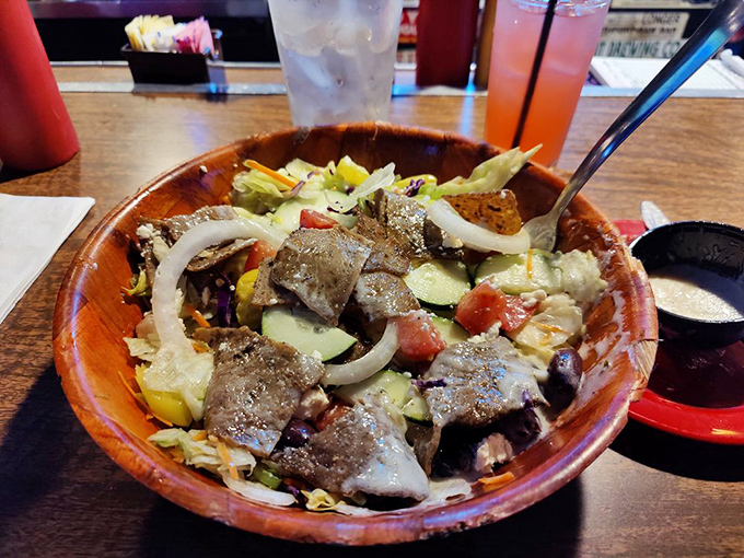 For those seeking lighter fare (relatively speaking), the Macedonian salad offers a nod to heritage with generous portions of meat atop fresh vegetables.
